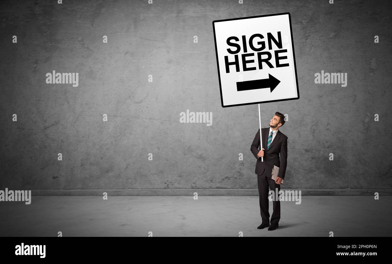 business person holding a traffic sign Stock Photo - Alamy