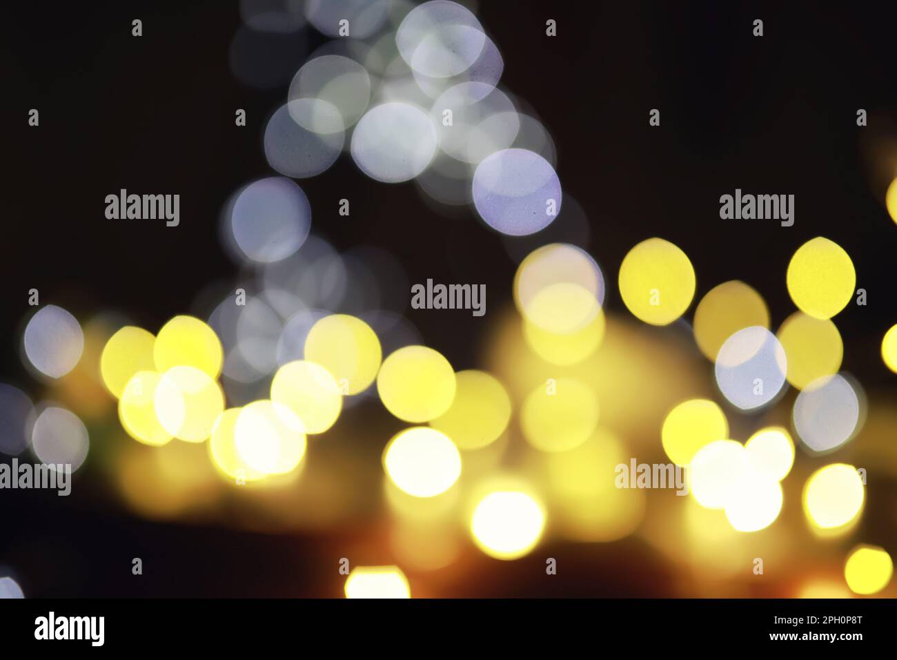 Abstract bokeh background. Golden bokeh circles on a dark blue ...