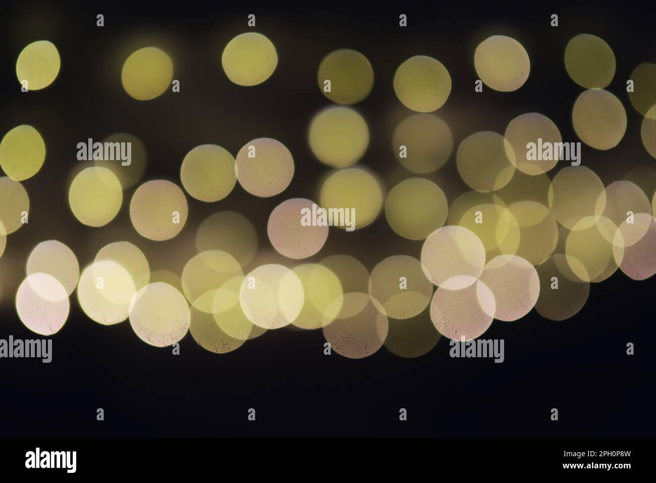 Abstract bokeh background. Golden bokeh circles on a dark blue ...