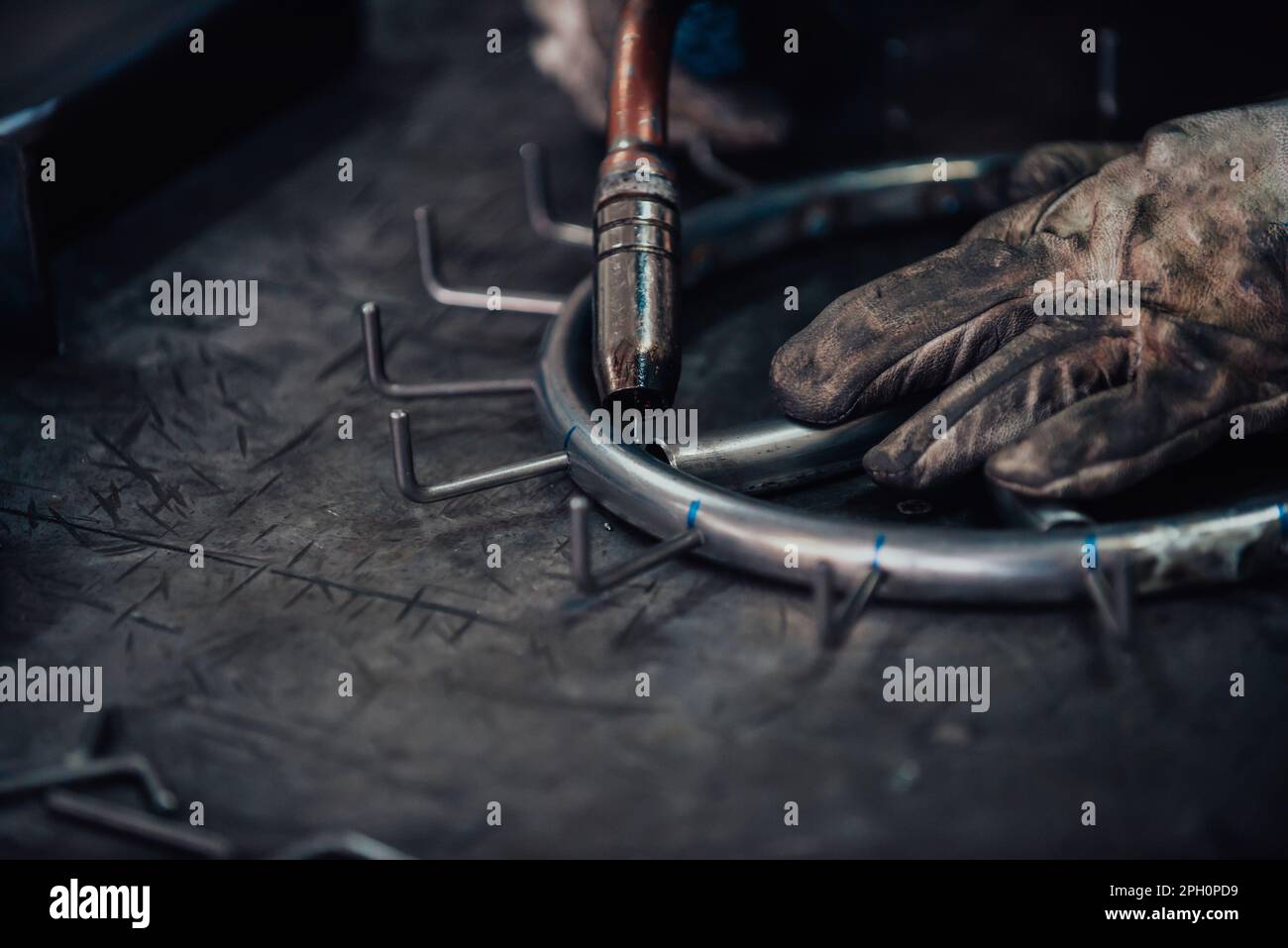 Close up of the steel welding process. Work in the heavy steel industry ...