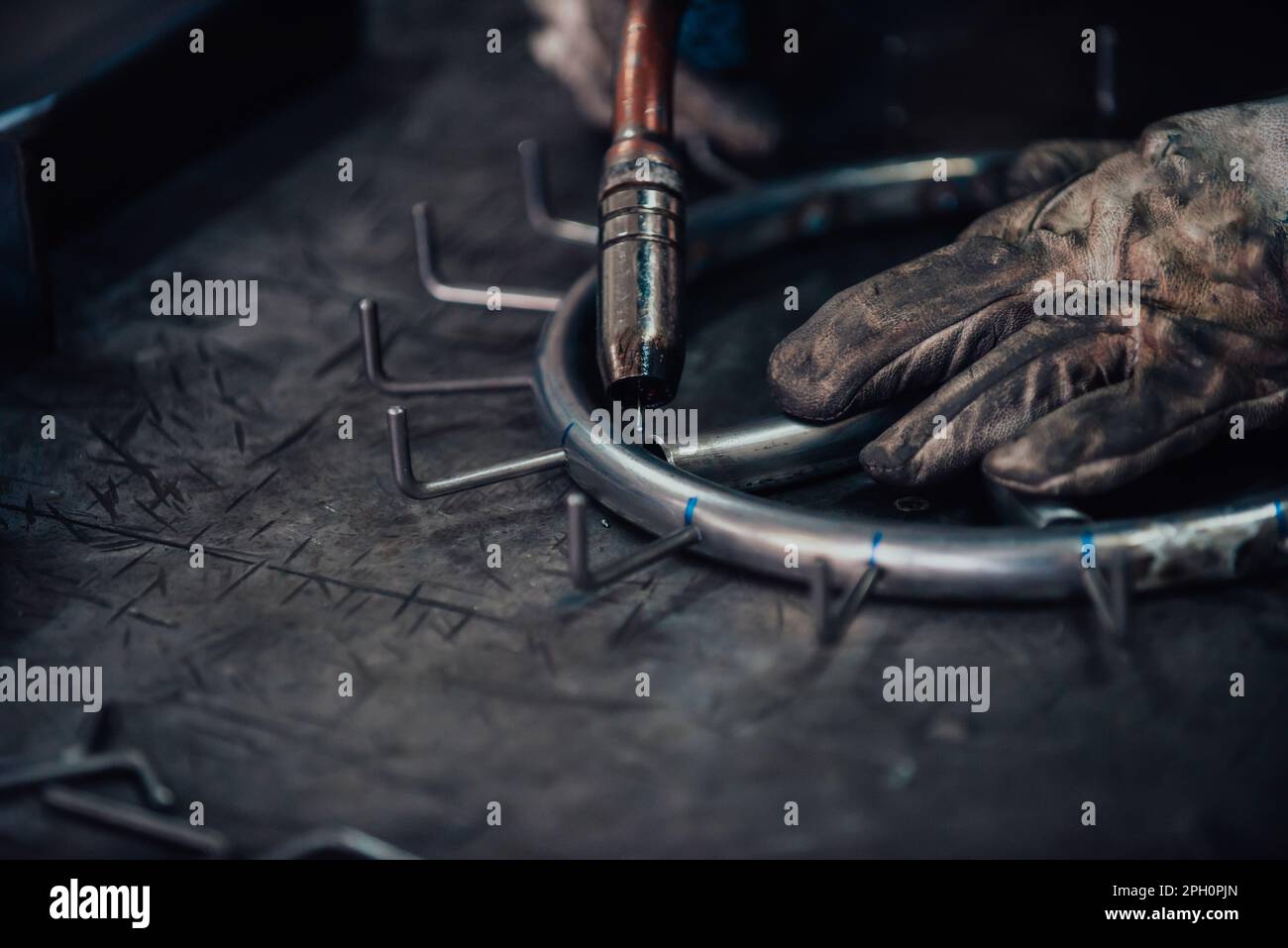 Close up of the steel welding process. Work in the heavy steel industry ...