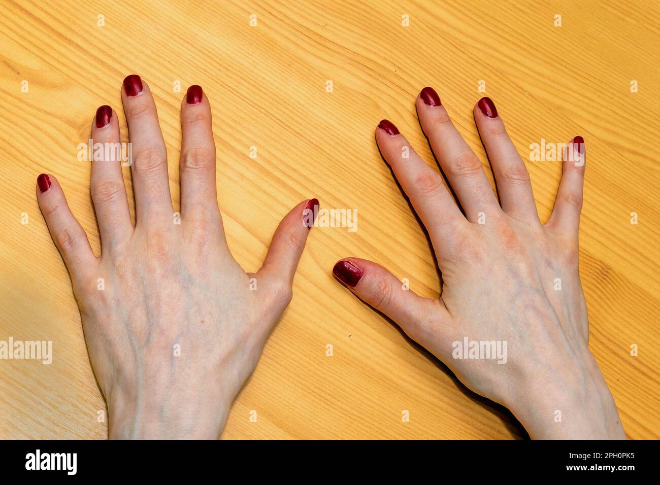 Elegant clean female hands with manicured nails painted with red nail ...