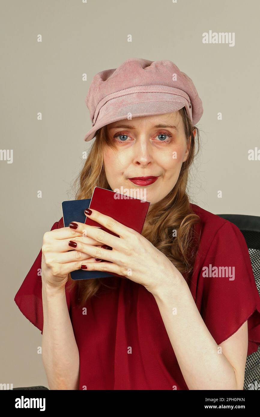 Woman Holding Two Passports In Her Hands Getting Ready To Cross