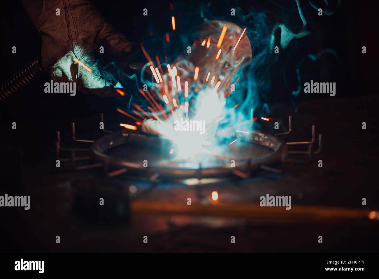 Close up of the steel welding process. Work in the heavy steel industry ...