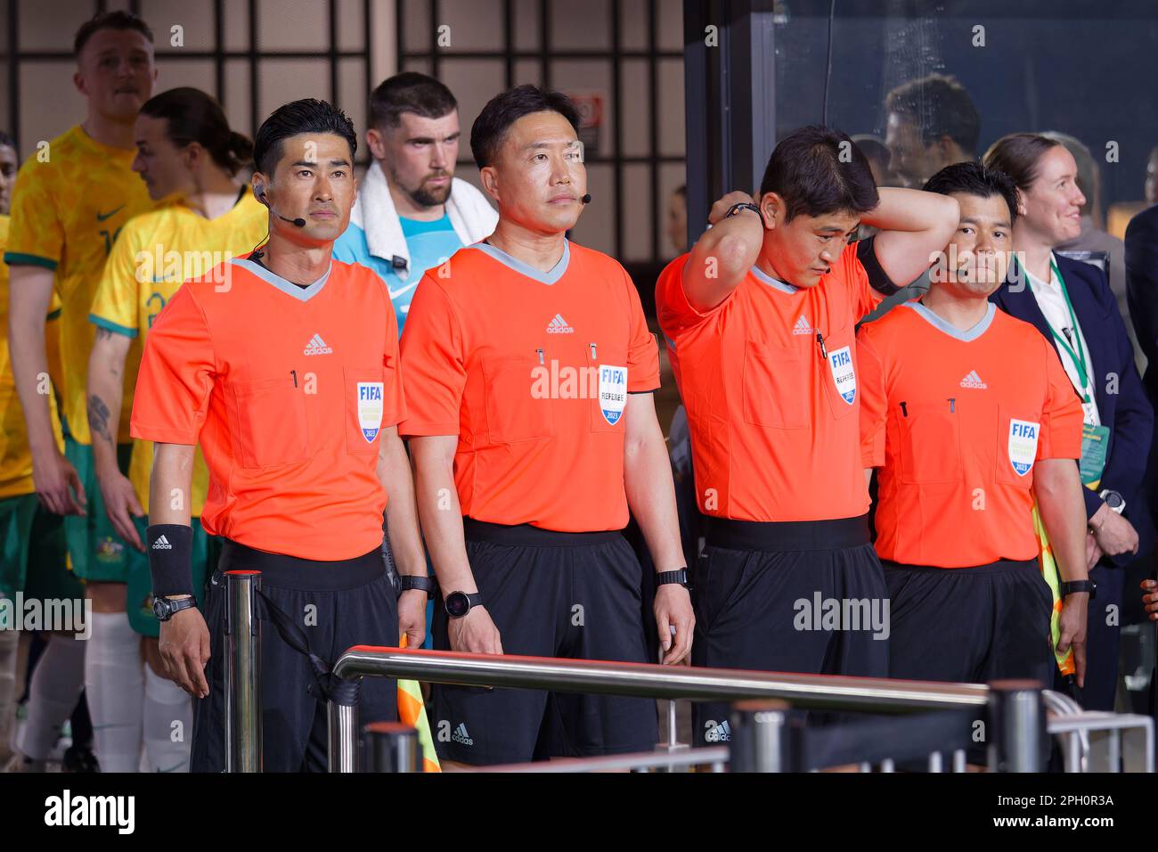 Match referees prepare to walk onto the field before the match between ...