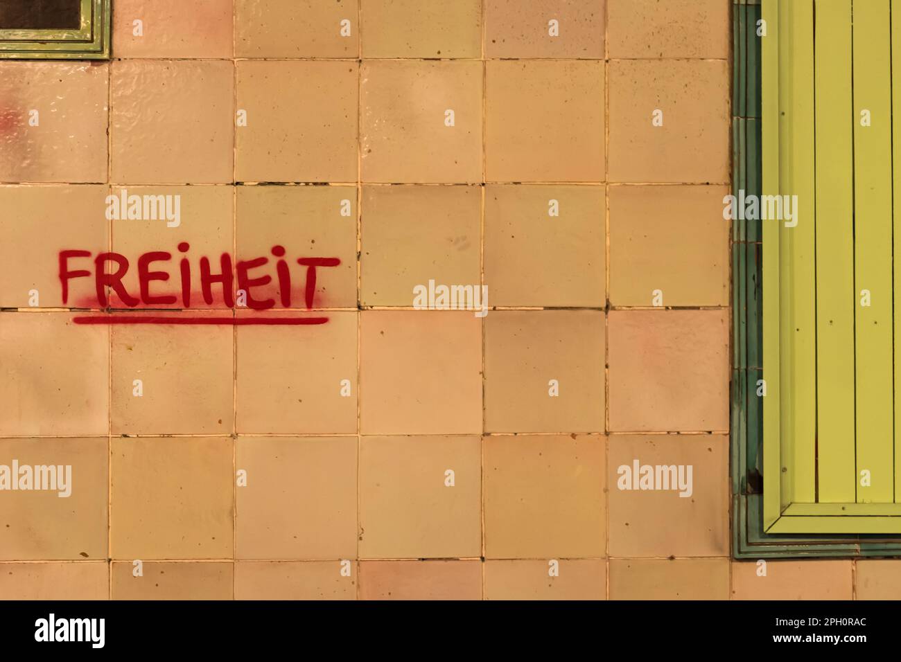 The word freedom as graphic lettering on a wall Stock Photo - Alamy