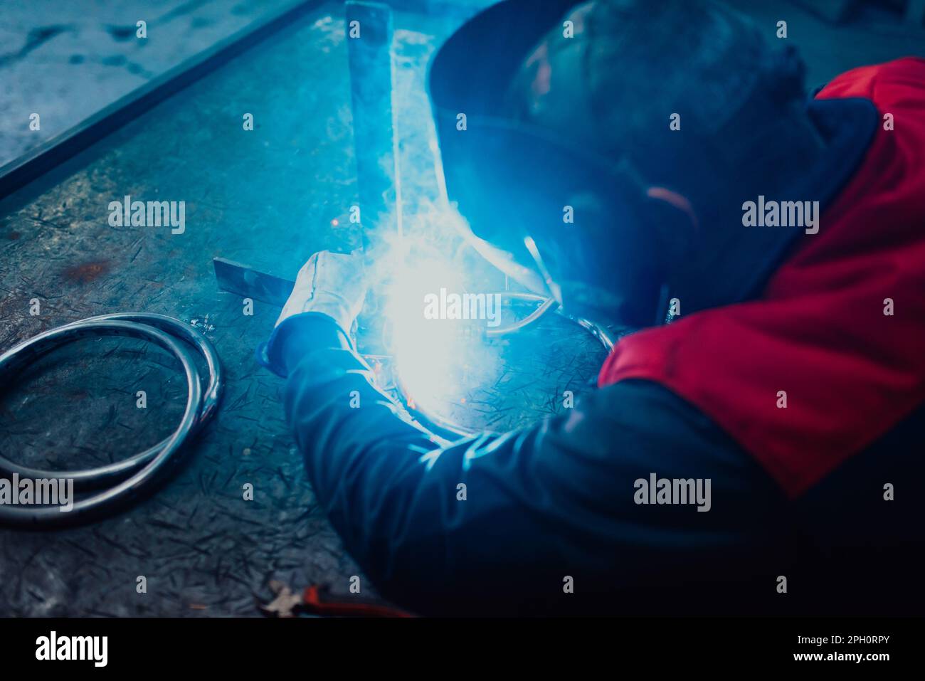 Close up of the steel welding process. Work in the heavy steel industry ...