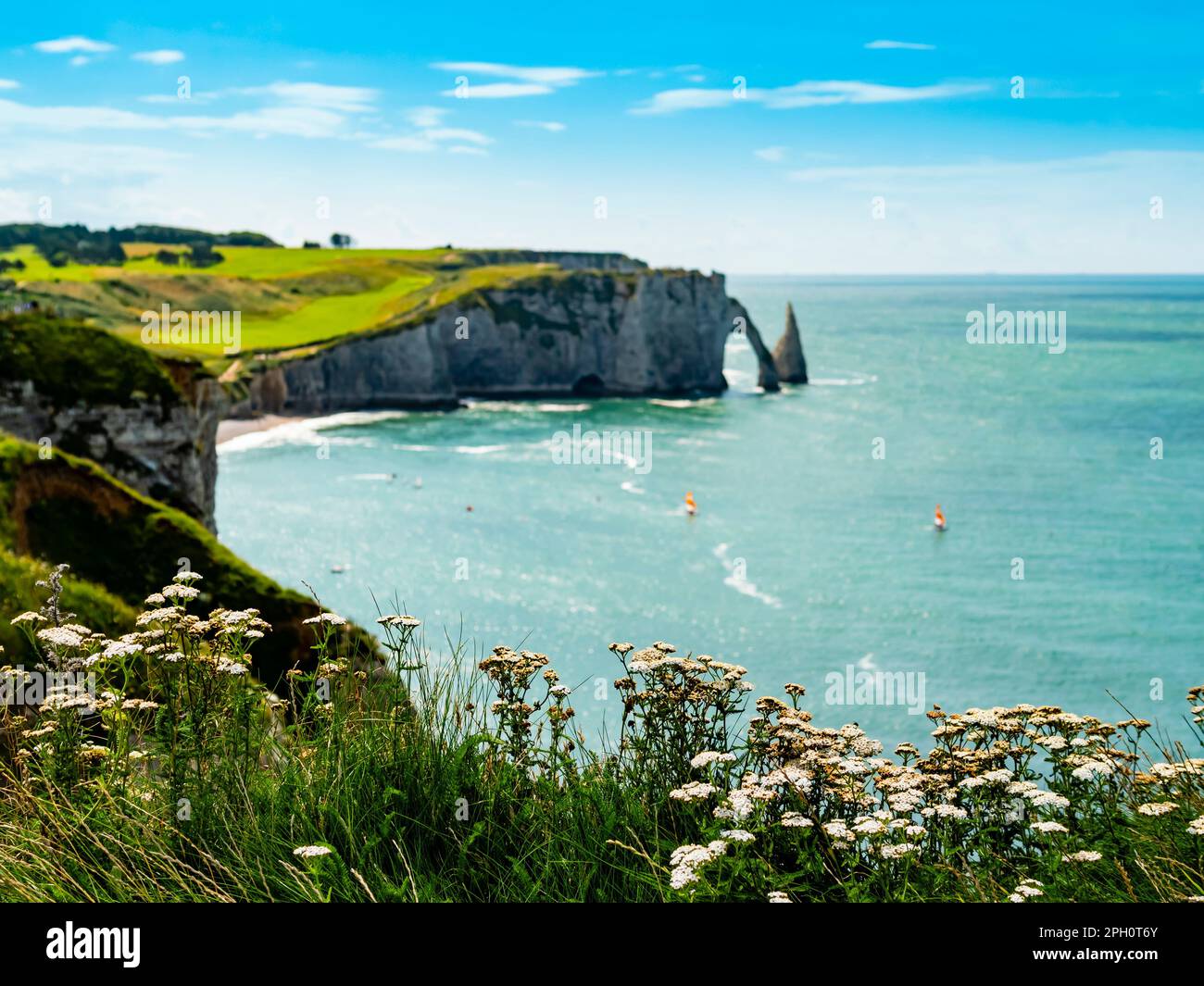 Dreamlike view of Etretat coastline, green fields and vertical chalk ...