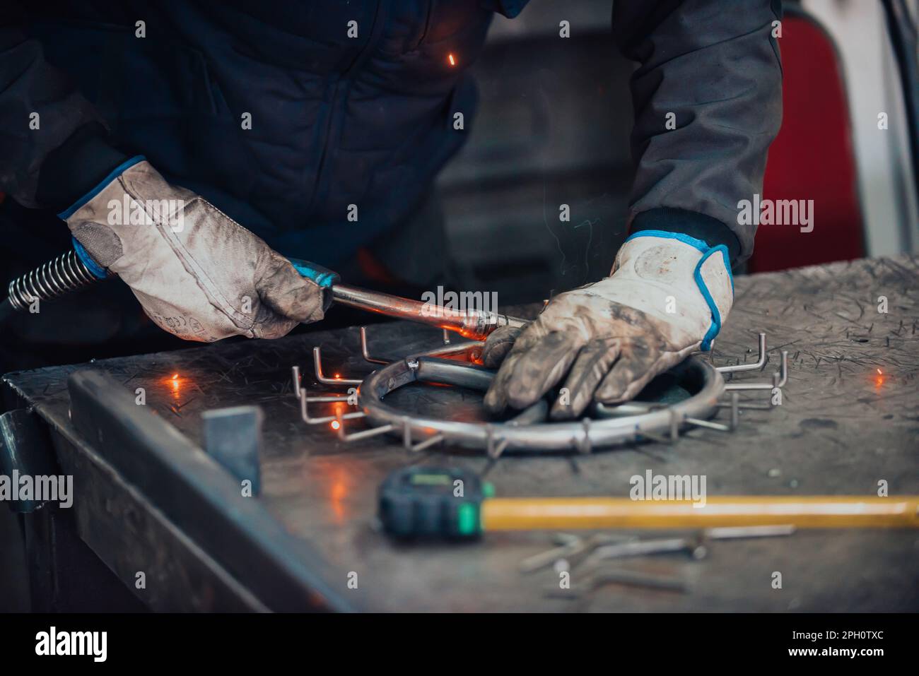 Close up of the steel welding process. Work in the heavy steel industry ...