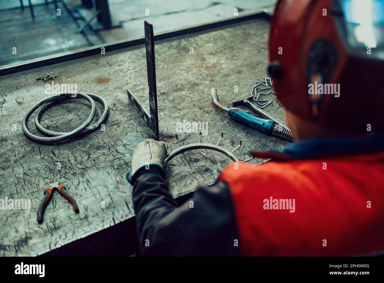 Close up of the steel welding process. Work in the heavy steel industry ...