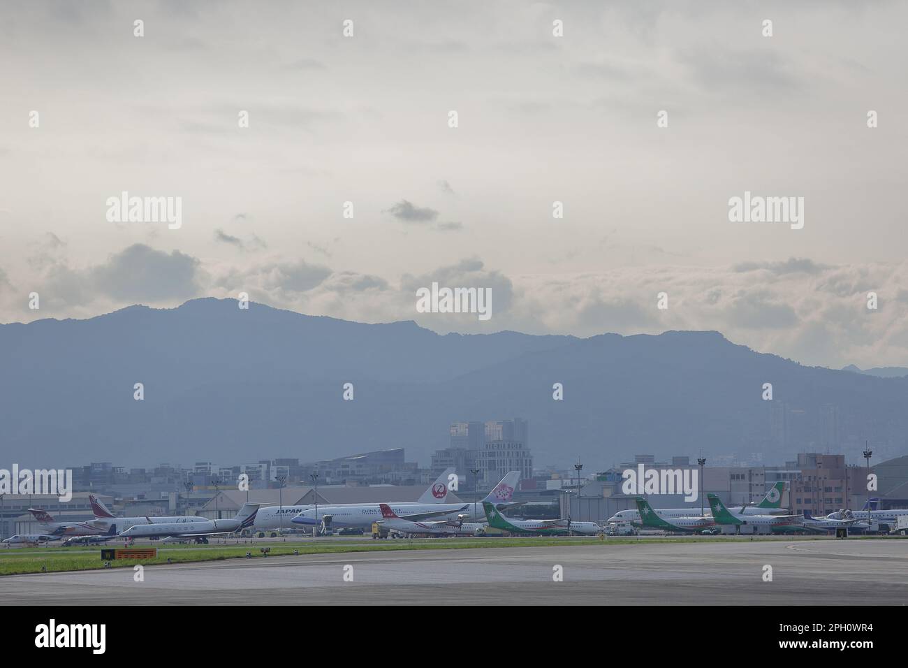 Taipei Songshan Airport, mountains in the background Stock Photo - Alamy
