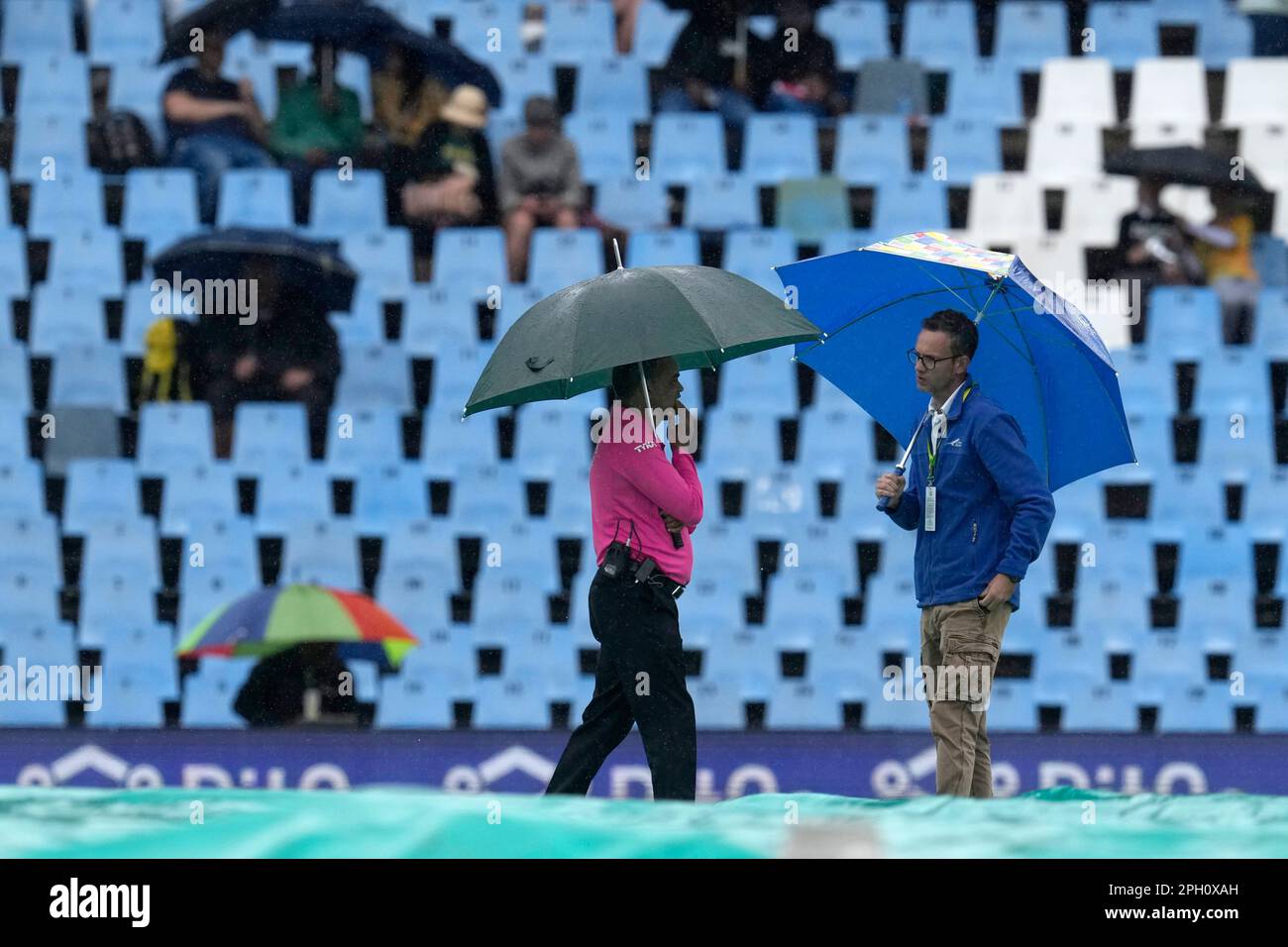 Reserve umpire Shaun George of South Africa, left, chats with head ...