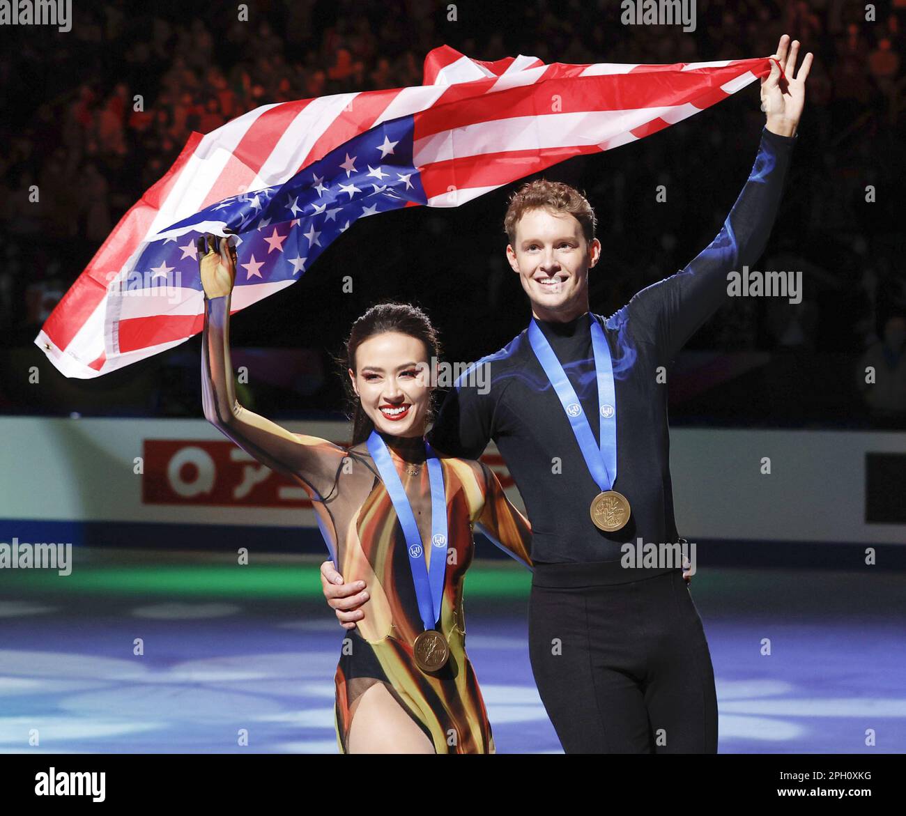 Madison Chock (L) and Evan Bates of the United States wave their ...