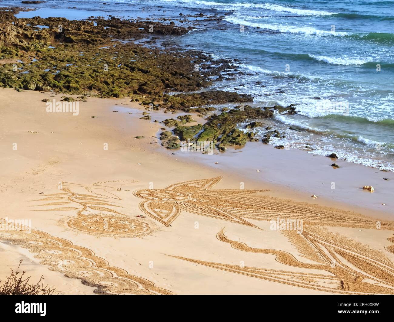 Beautiful beach sand mandala in Albufeira in Portugal Praia Maria Luisa ...