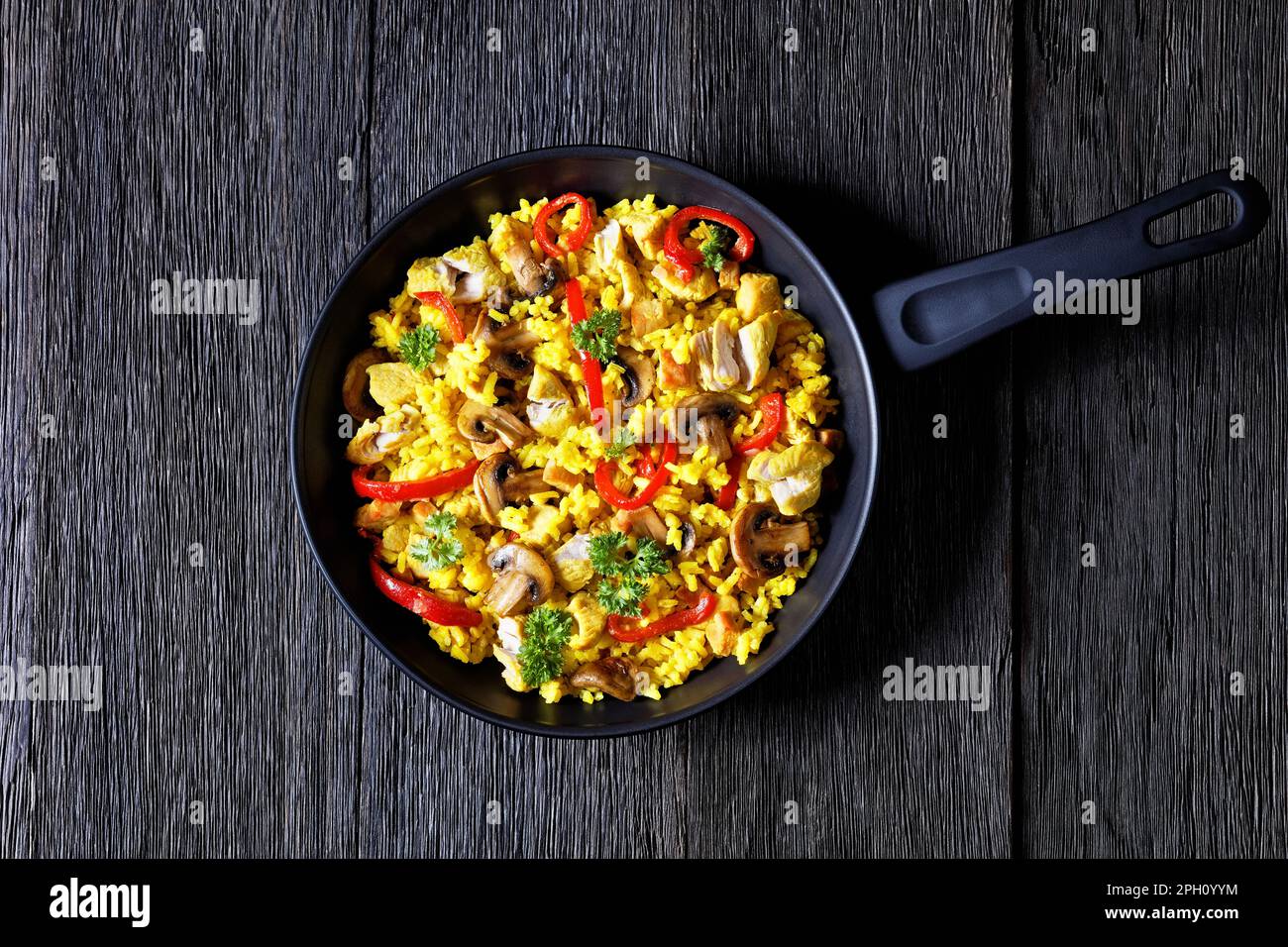 Chicken Paella of arborio rice, chicken fillet, mushrooms, julienned ...
