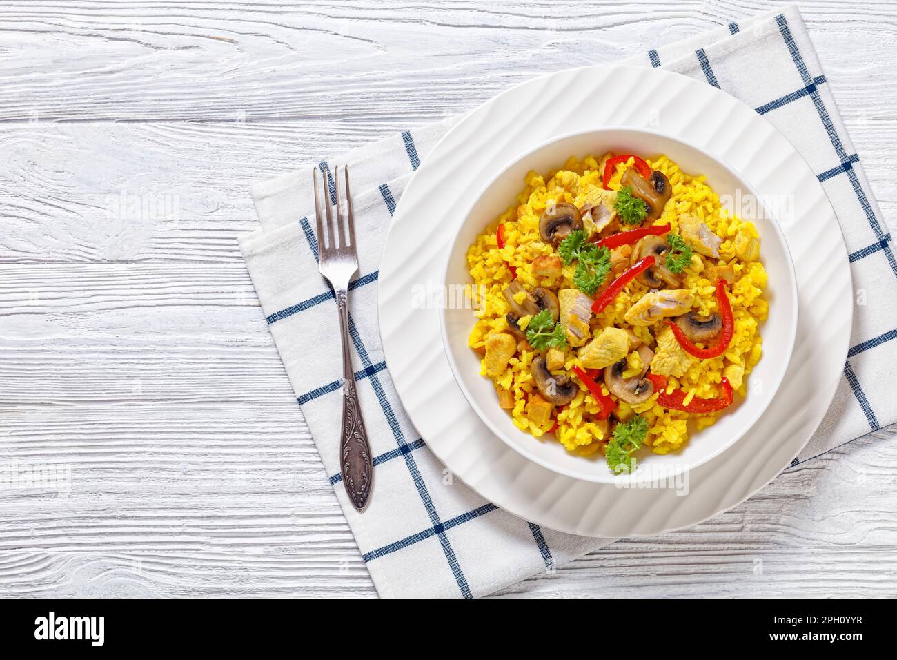 Chicken Paella of arborio rice, chicken fillet, mushrooms, julienned ...
