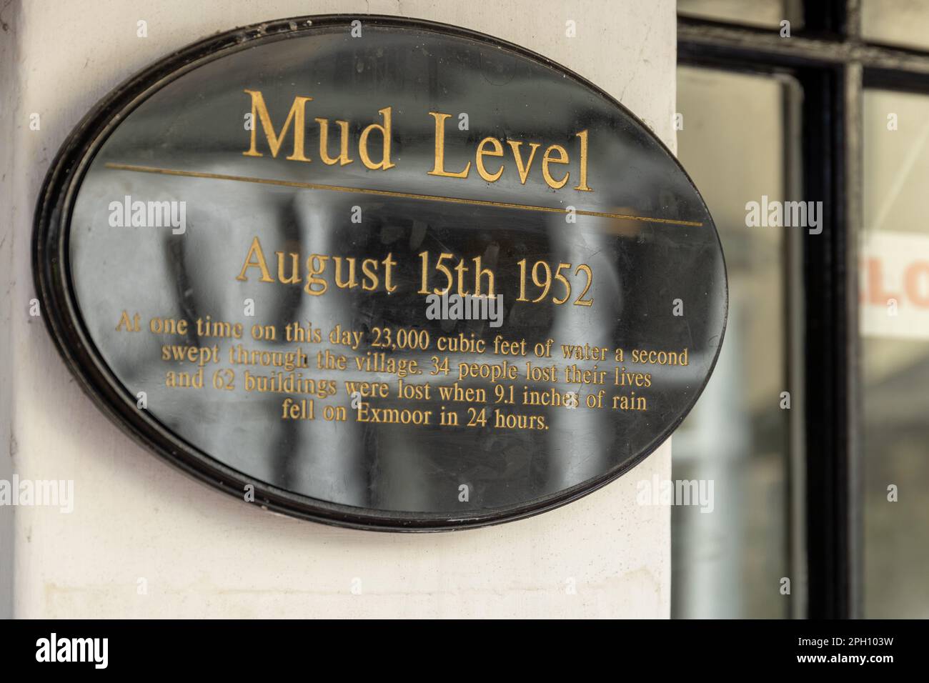 A sign showing the mud level after the 1952 floods in Lynmouth Stock ...