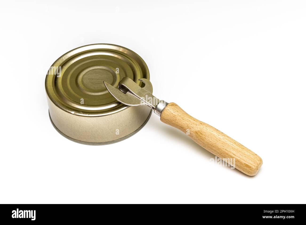 old tin can with a bottle opener on a white background. closed tin can ...