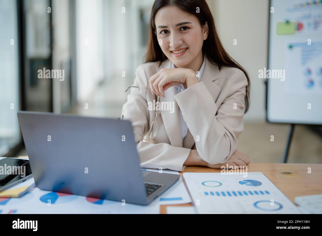 Portrait of a woman business owner showing a happy smiling face as he ...