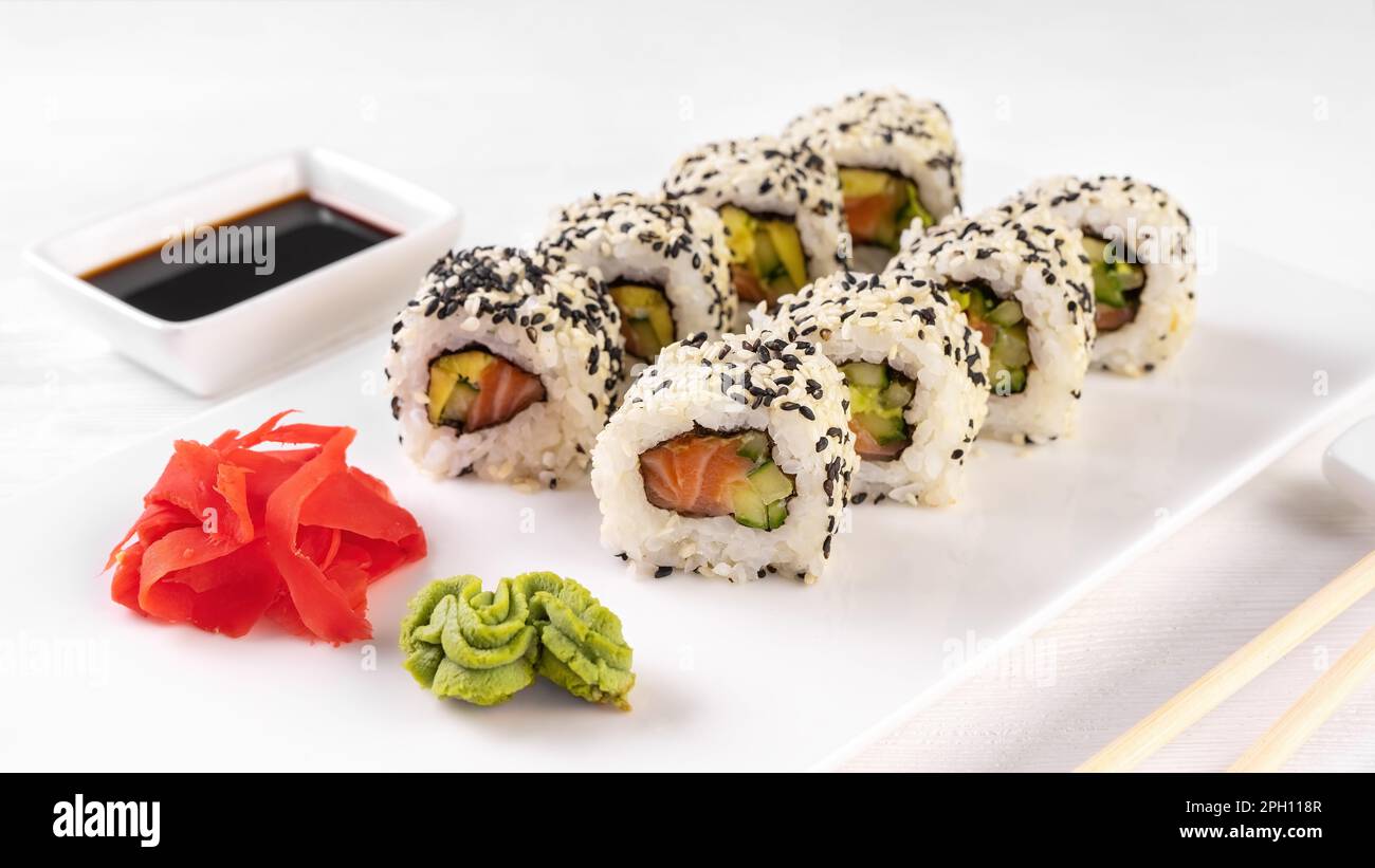Sushi roll California with salmon, sesame seeds, avocado, cream cheese ...