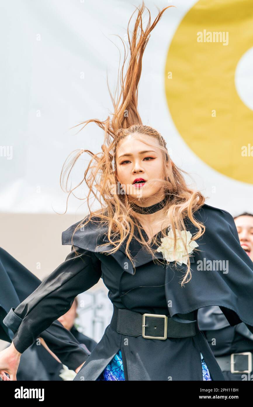 Close up of young Japanese woman dancer wearing black costume on an ...