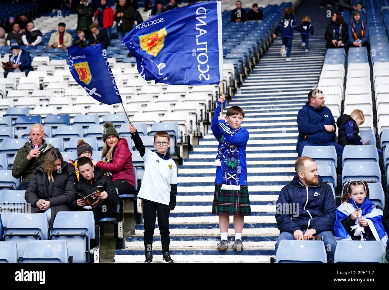 Young Scotland fans waving flags in the stands before the UEFA Euro ...