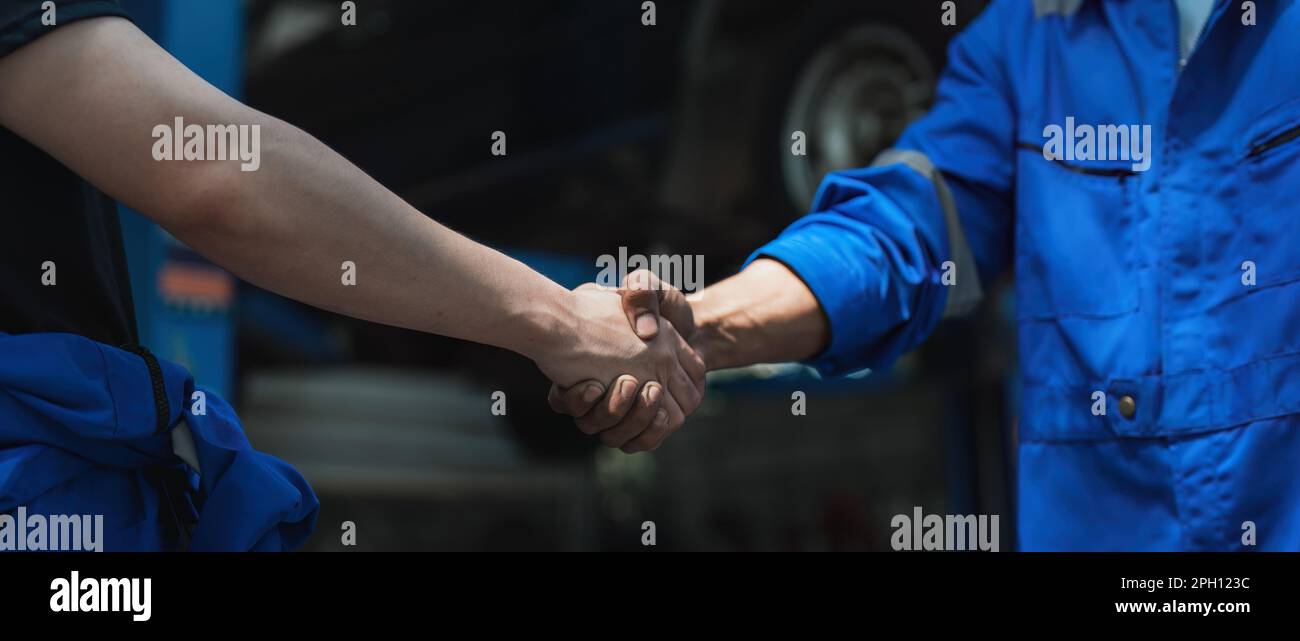 Woman shaking hands mechanic hi-res stock photography and images - Alamy