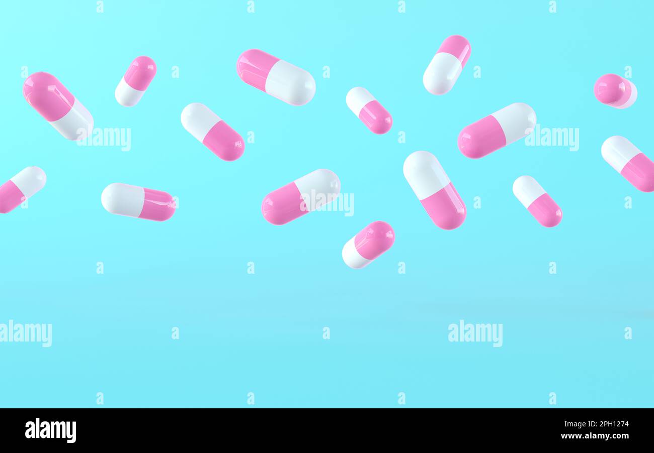 Flying medical capsules on a blue background with copyspace. Medical ...