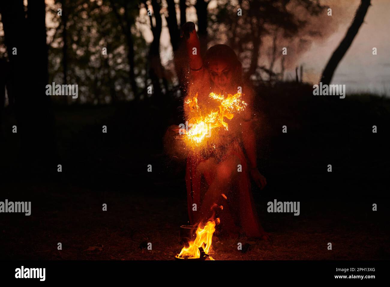 Girl fire dancing performance at outdoor art festival, smooth movements ...