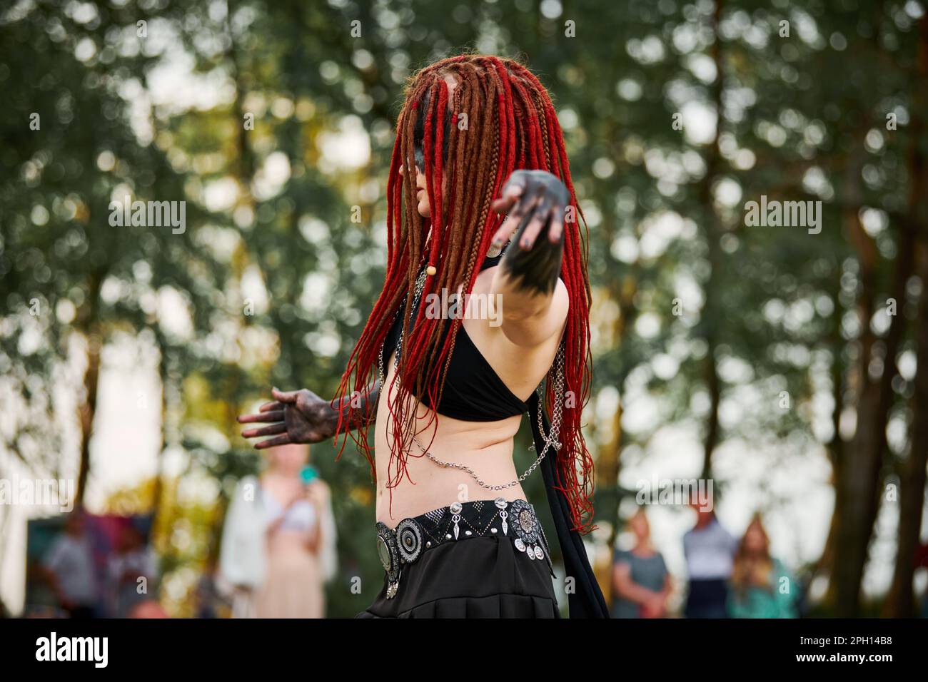 Mythological dancing girl faun on green lawn in public park outdoor art ...