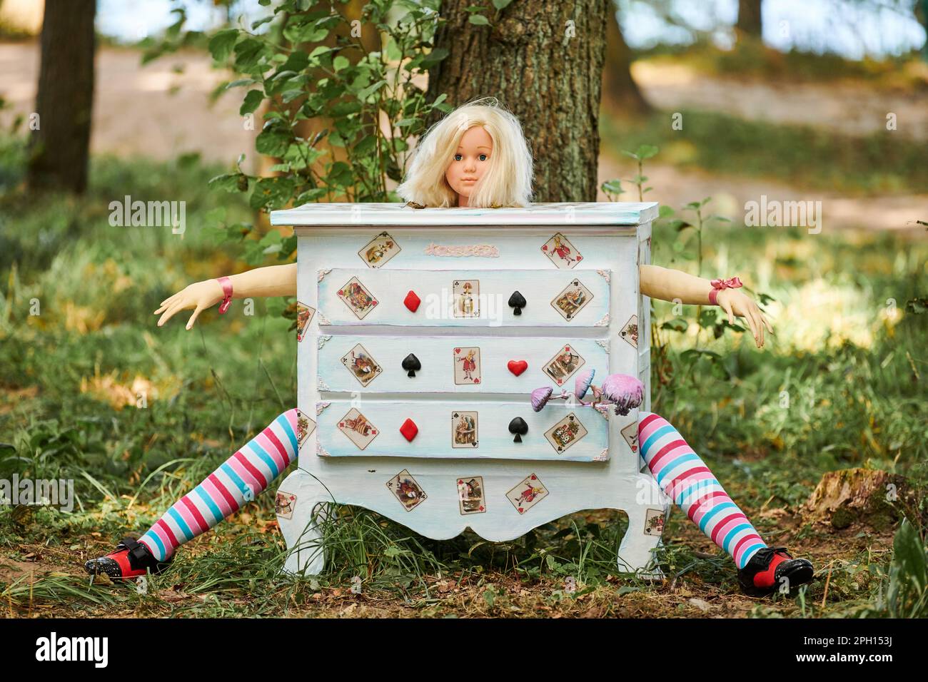 Dresser with doll Alice inside near Humpty Dumpty and mushrooms art ...