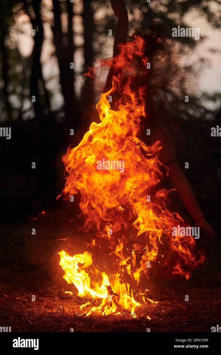 Girl fire dancing performance at outdoor art festival, smooth movements ...