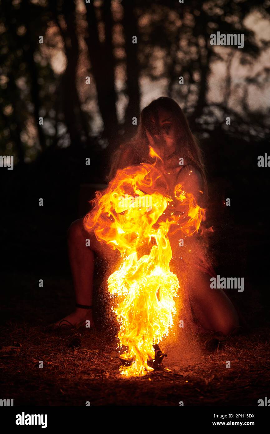 Girl fire dancing performance at outdoor art festival, smooth movements ...