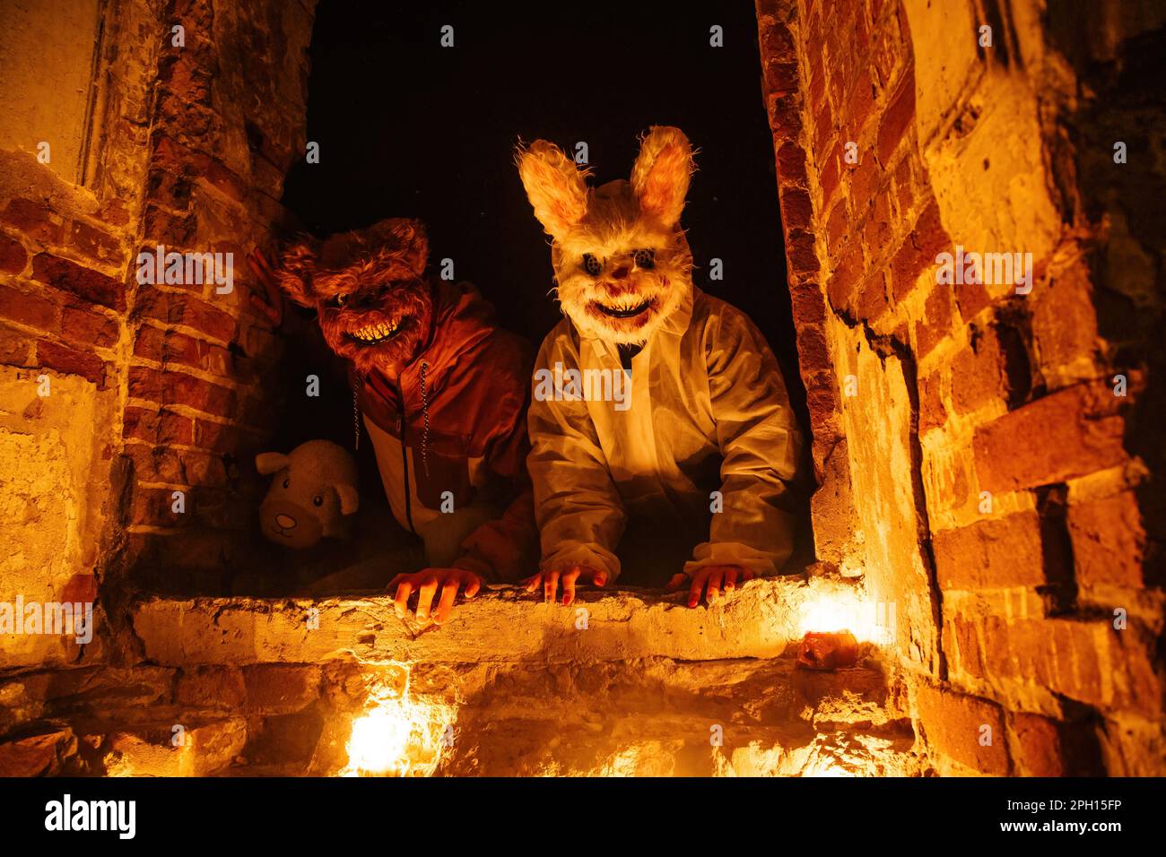 Man in mask of scary rabbit and bear Stock Photo - Alamy