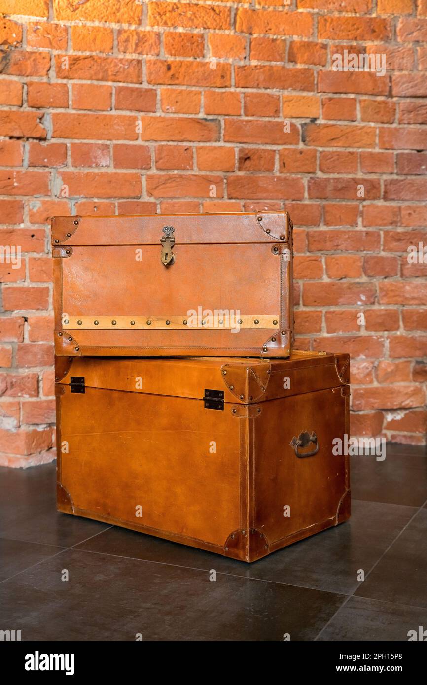 two retro decorative cases or storage boxes on a brick wall background ...