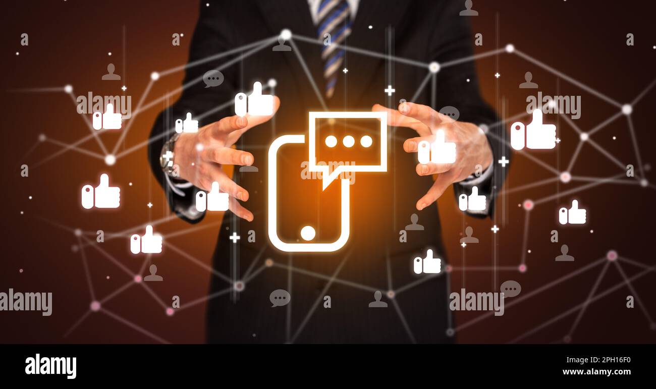 Hand holding social media icons Stock Photo - Alamy