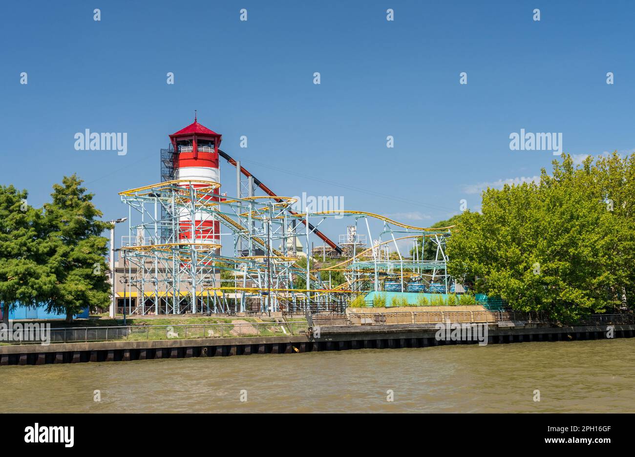 Slide, swing and roller coaster in the Parque de la Costa funfair and ...