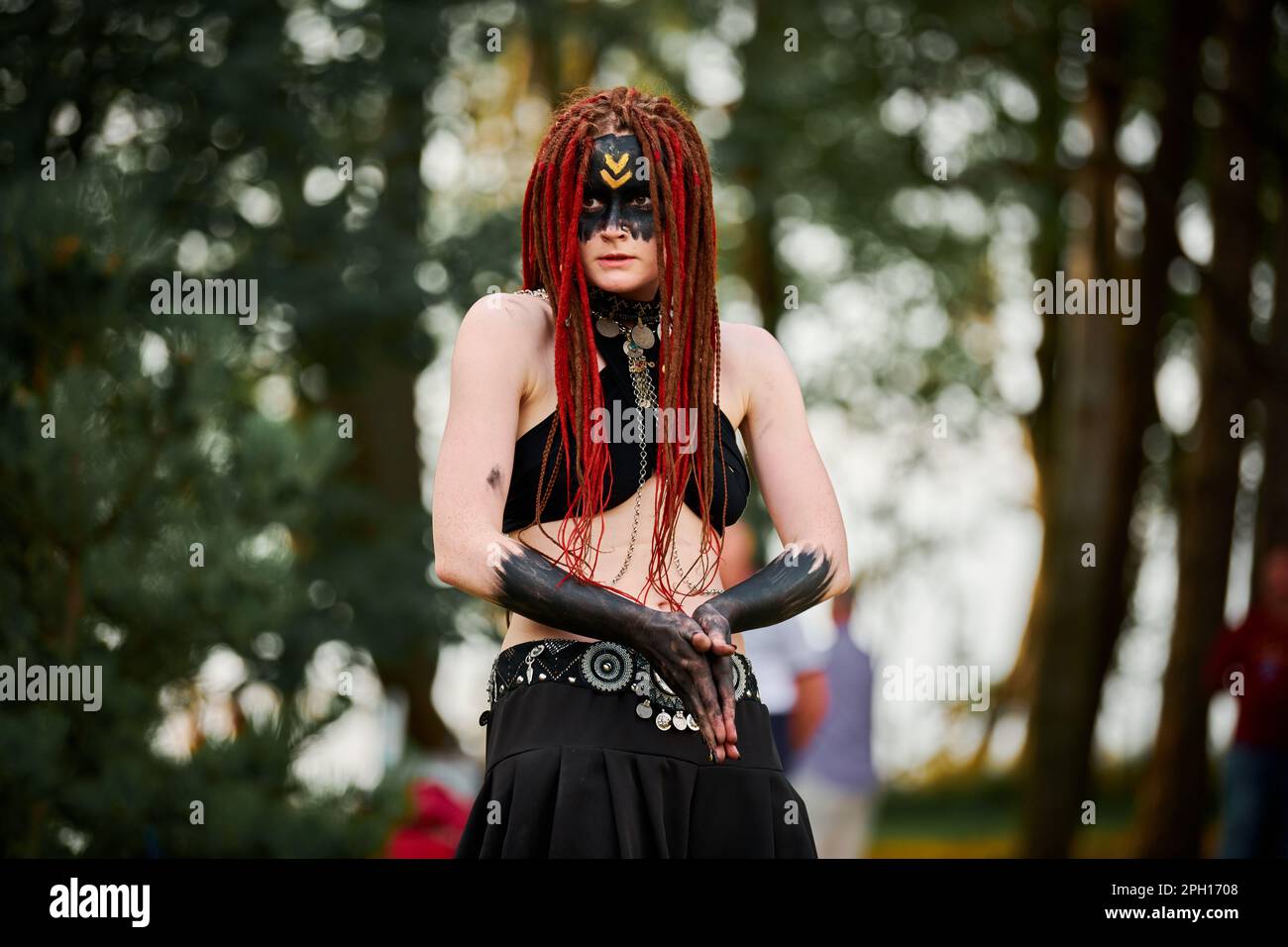 Mythological dancing girl faun on green lawn in public park outdoor art ...