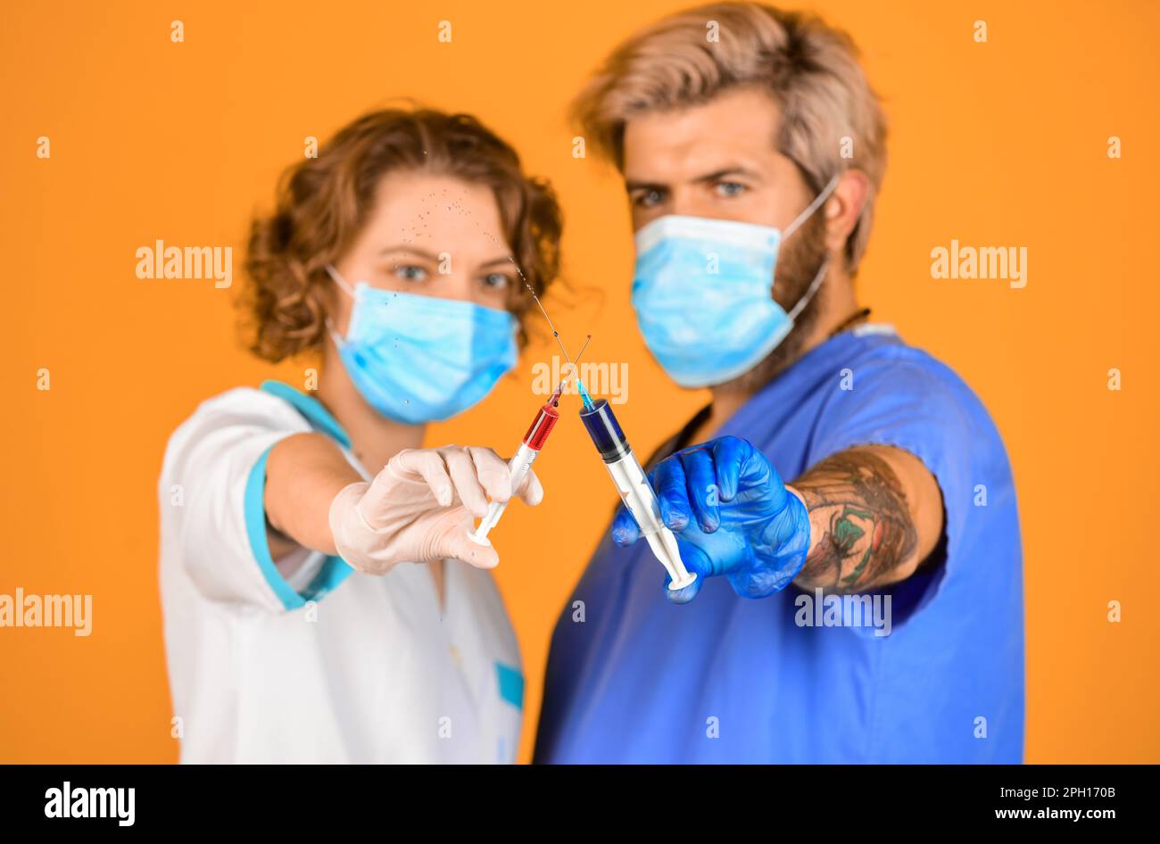 teamwork concept. virus infection injection vaccine. doctors wear ...