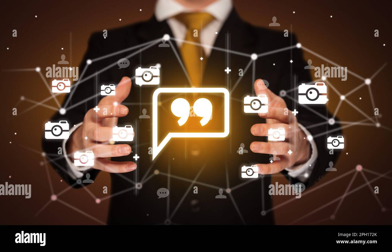 Hand holding social media icons Stock Photo - Alamy