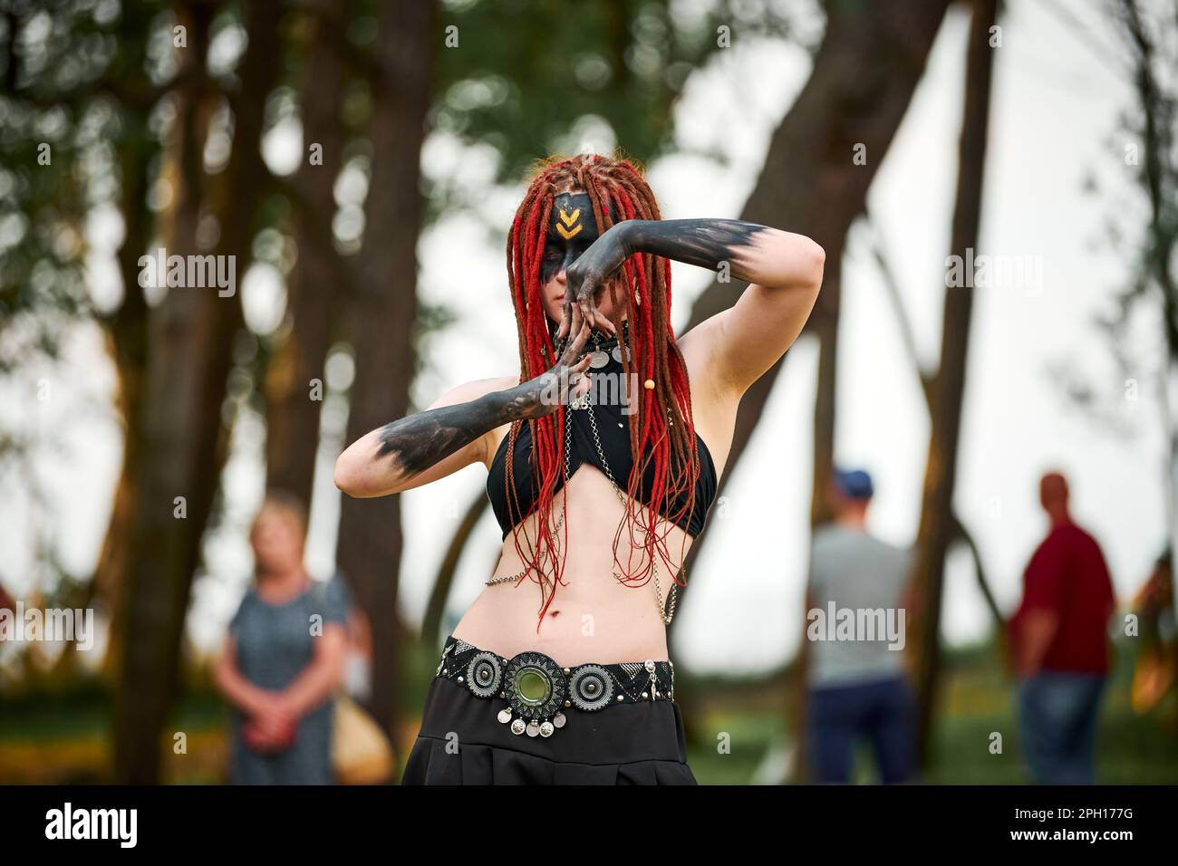 Mythological dancing girl faun on green lawn in public park outdoor art ...
