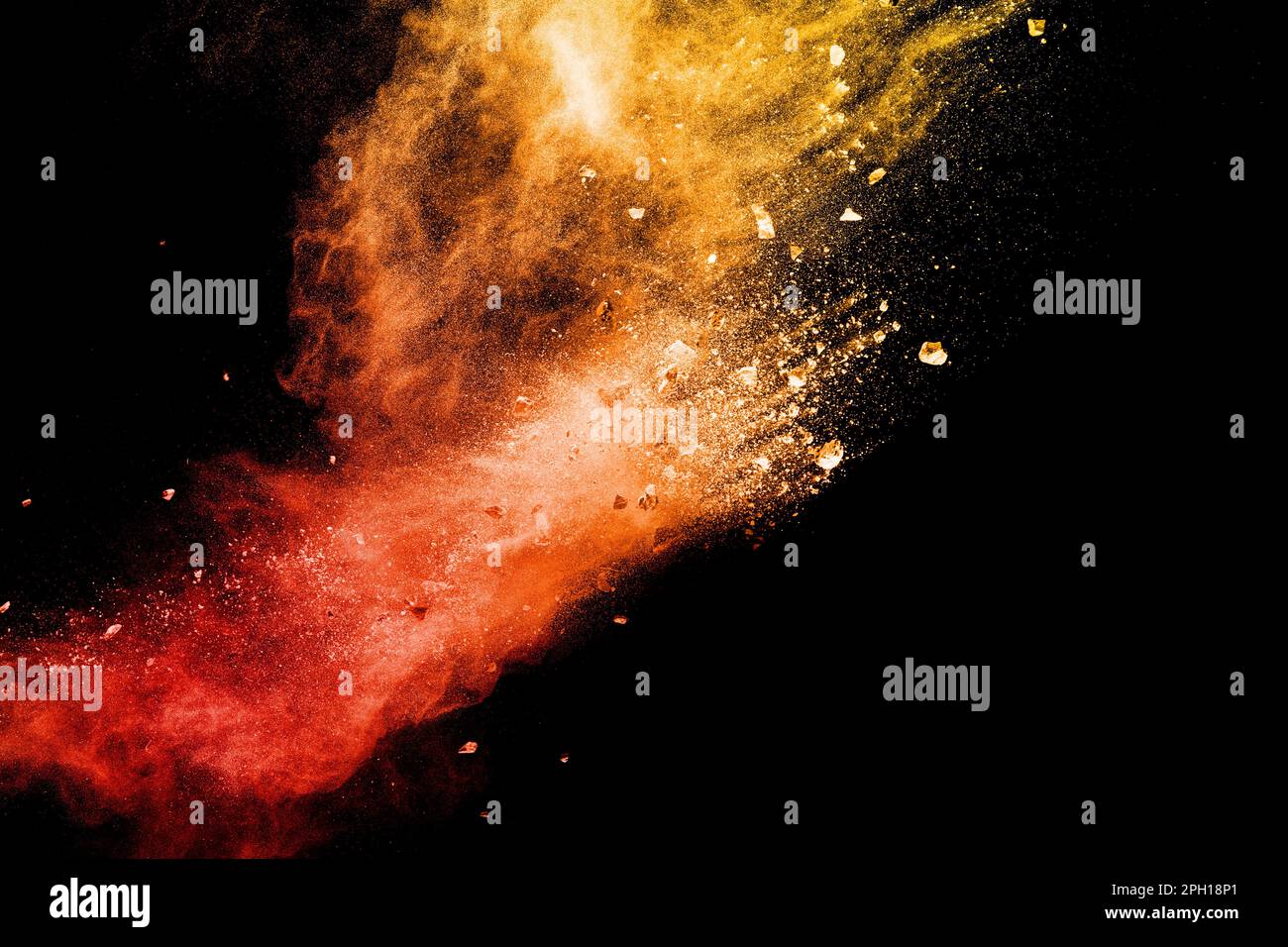 Split debris of stone exploding with orange red powder splash against ...