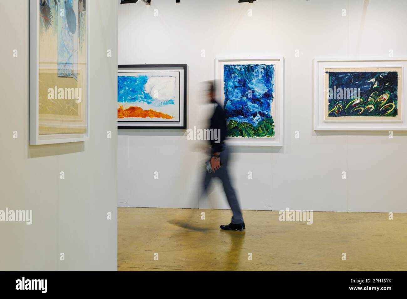Man Walking and Admiring Paintings in a Modern Art Gallery Stock Photo ...