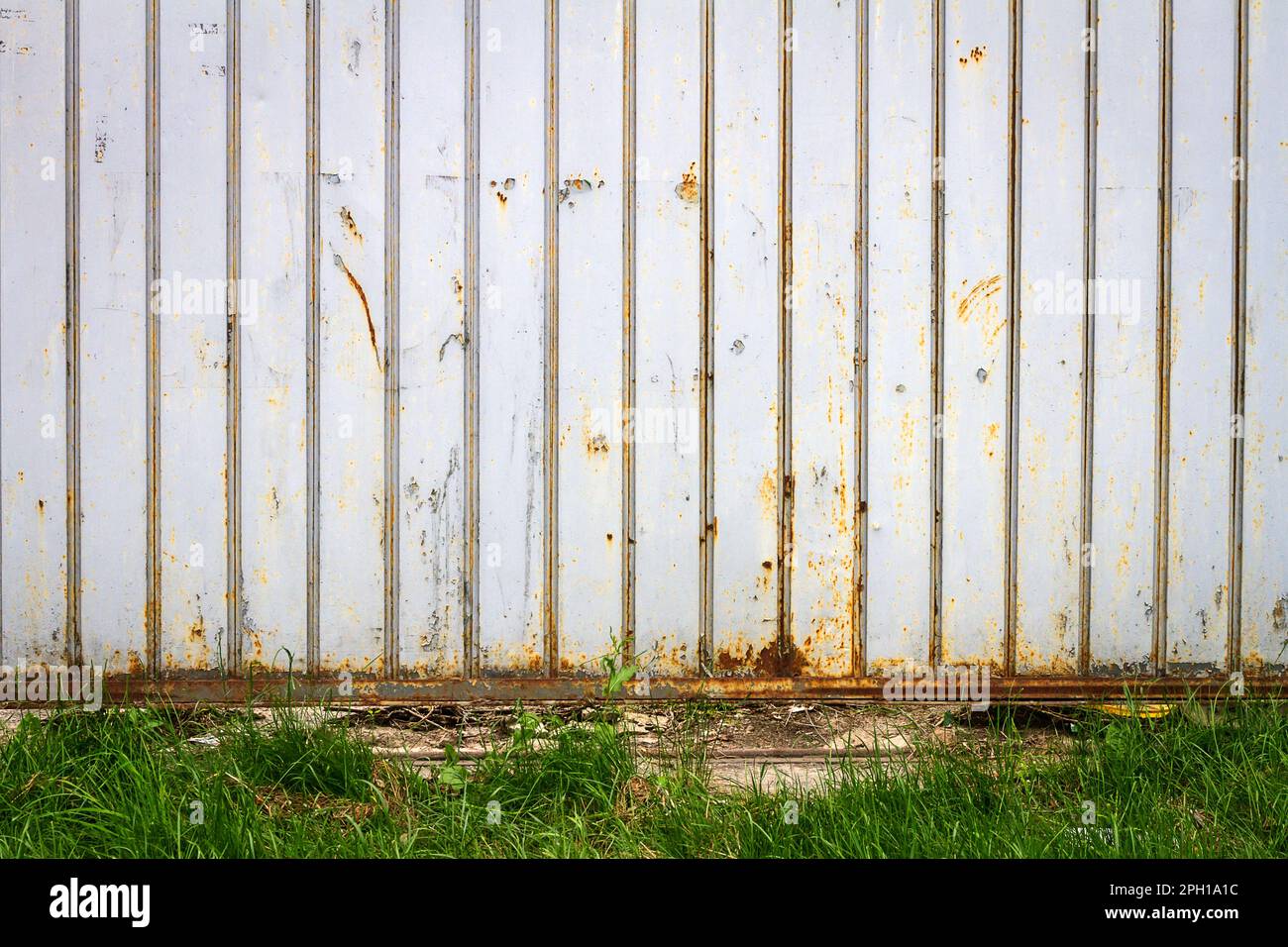 Old white metal warehouse wall. Architecture detail background. Metal ...