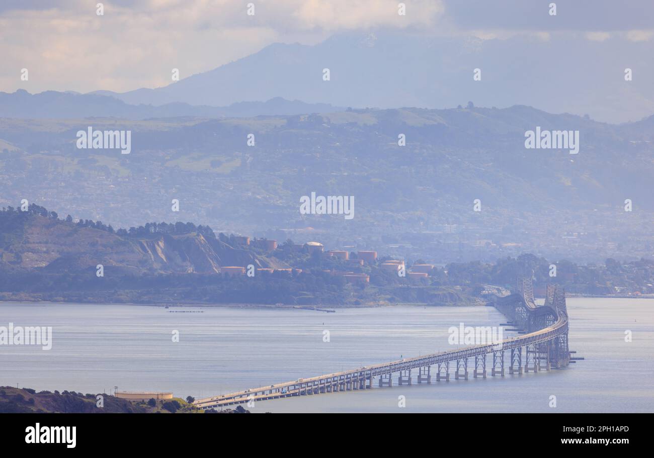Richmond - San Rafael Bridge curves over San Francisco Bay on hazy day Stock Photo - Alamy
