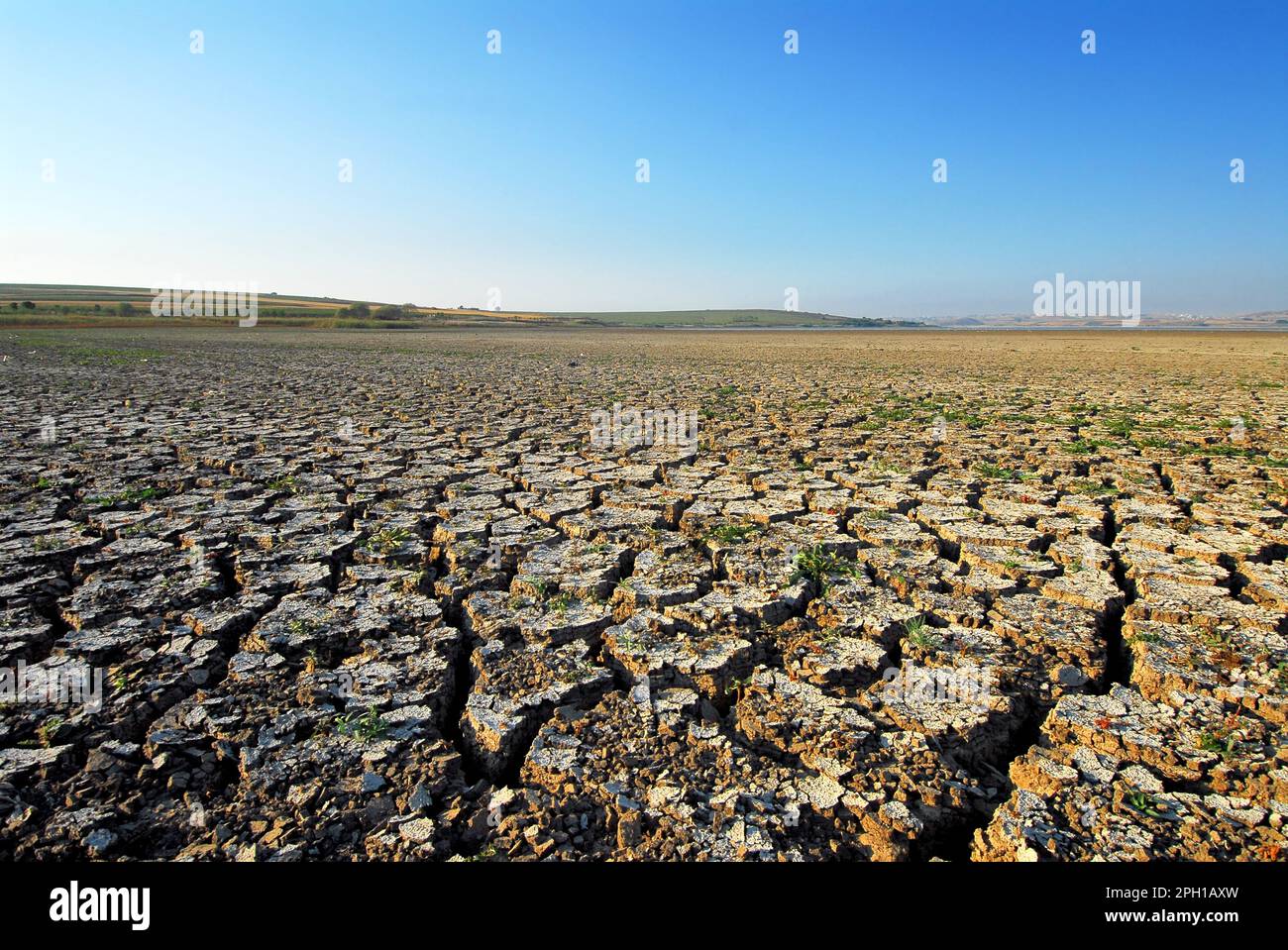 Dry soils cracked and pitted in the absence of water point to the world ...
