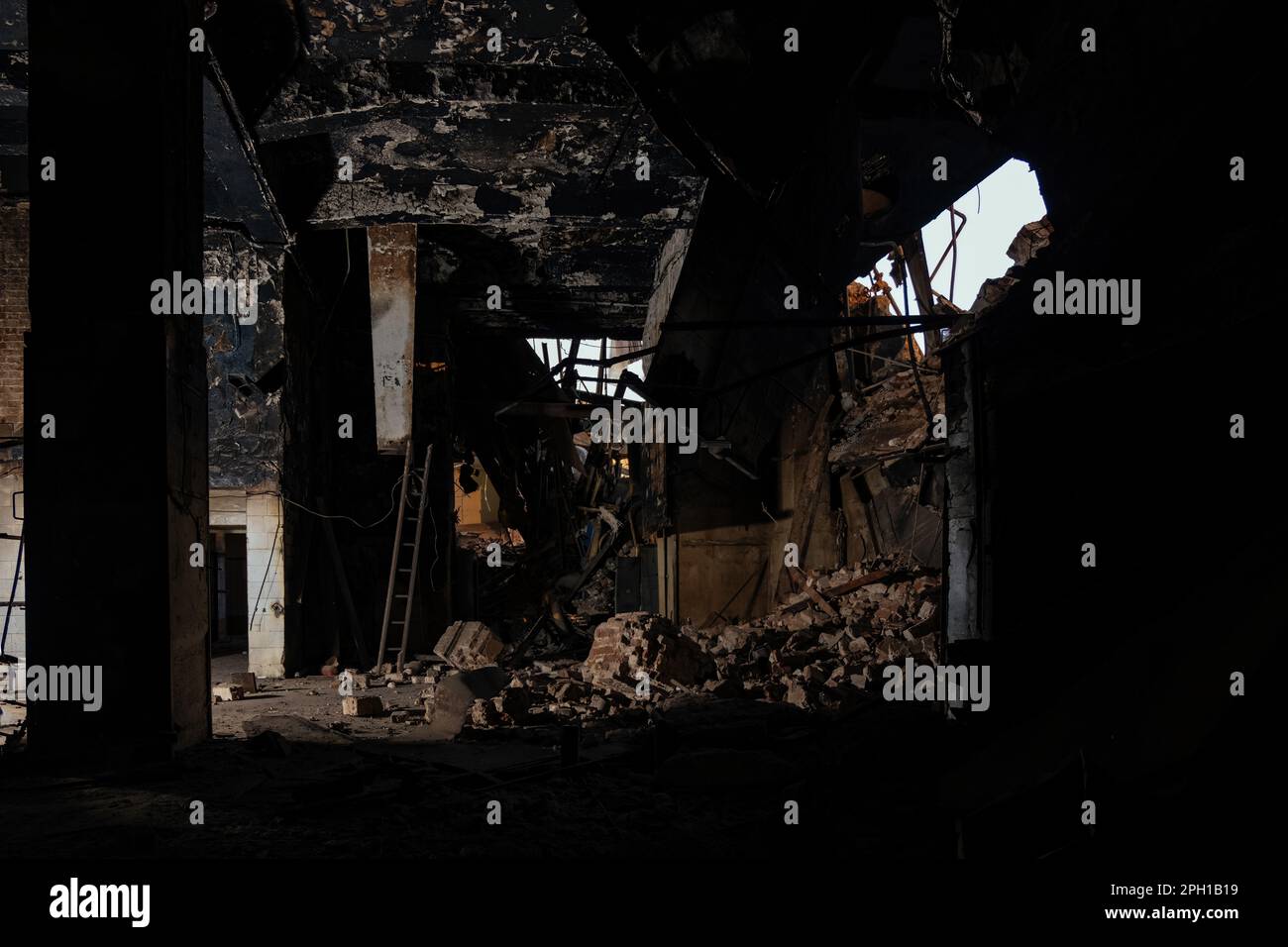 Burnt and ruined interior of industrial building after fire ...