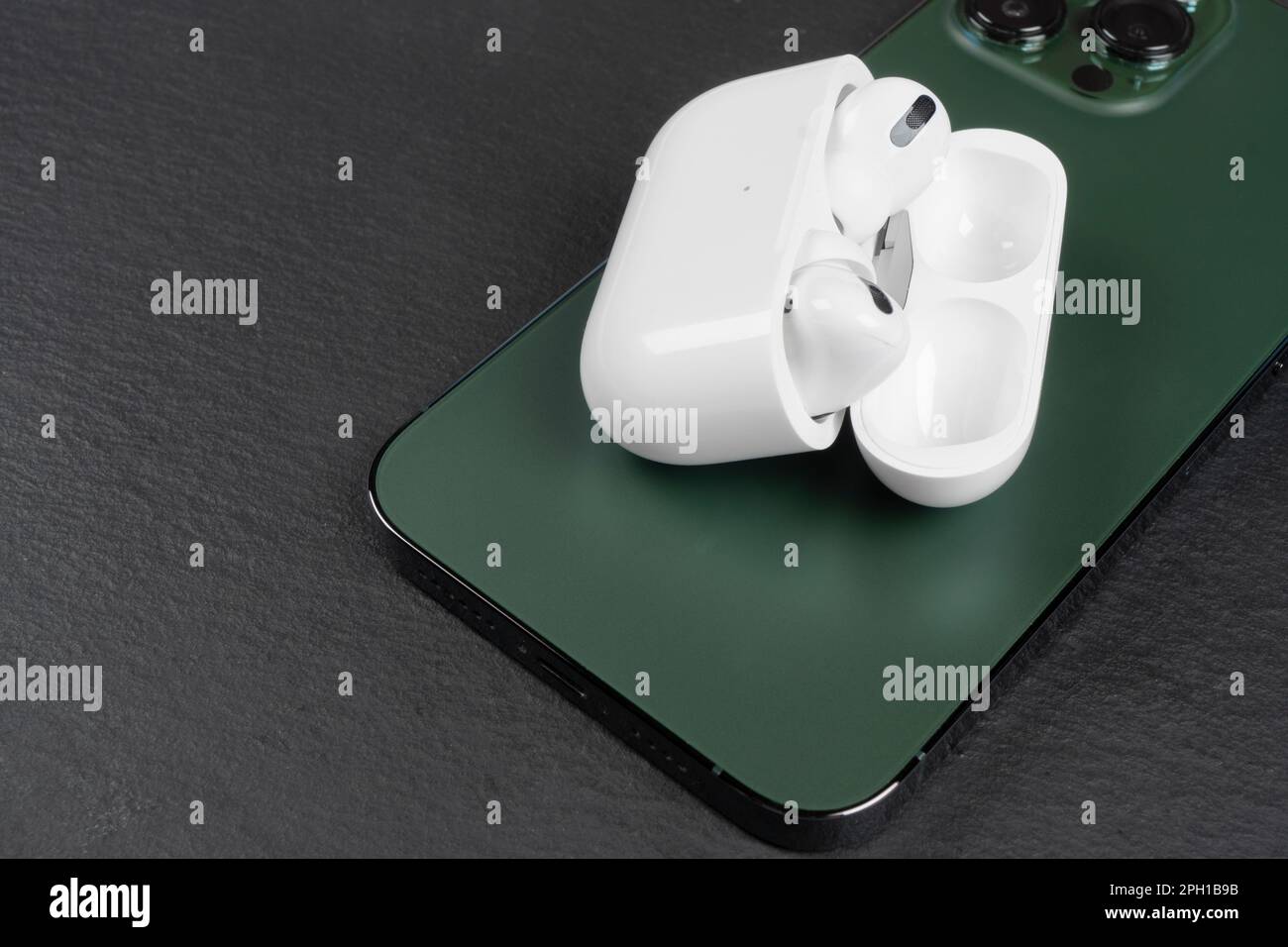 Modern wireless earbuds headphones with charging case iand smartphone ...