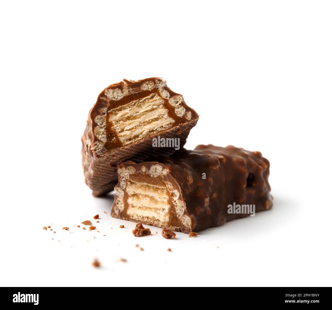 Two halves of a chocolate bar stuffed with crispy wafers and caramel ...
