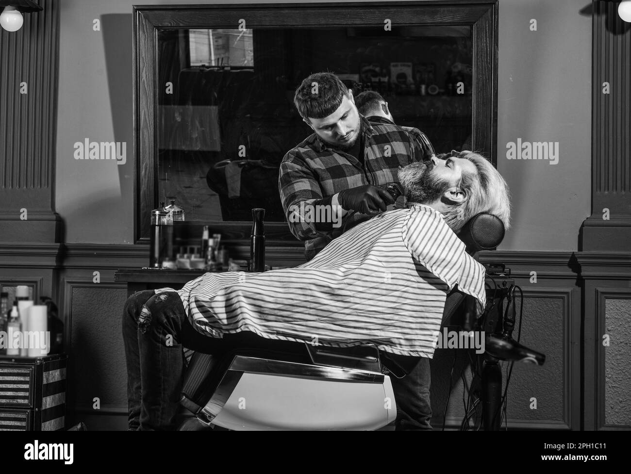 Hairdresser salon. Shaving with razor. Facial hair. Maintaining beard ...